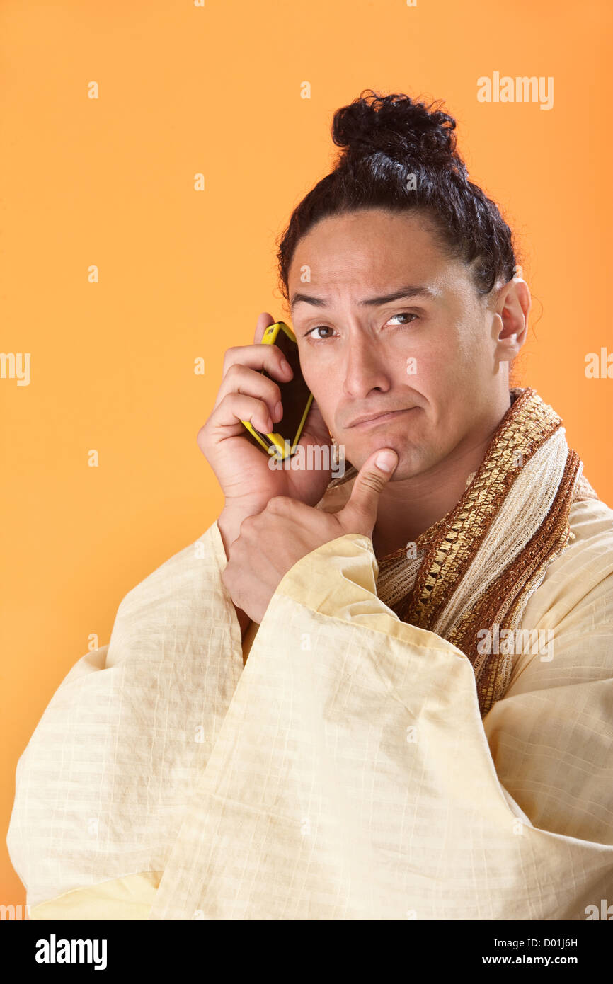 A Japanese Samurai thinking while talking on a mobile phone Stock Photo ...