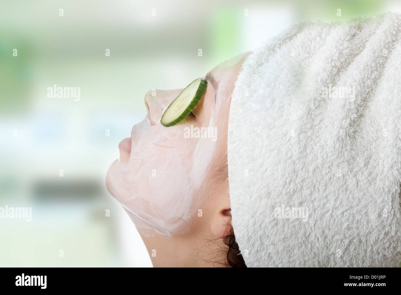 Beautiful woman with clay mask isolated Stock Photo - Alamy