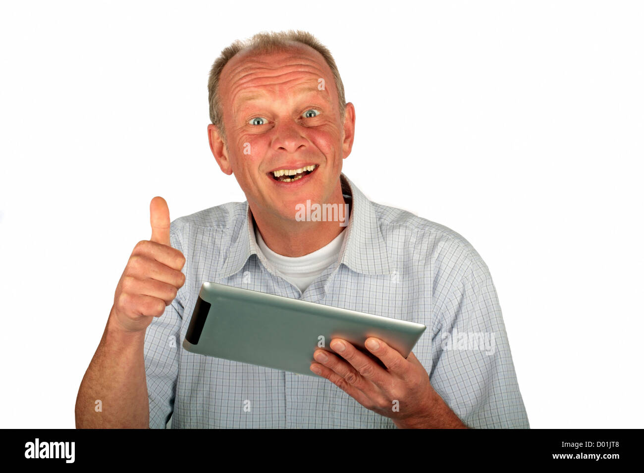 Happy man with thumbs up and his tablet computer on a white background ...