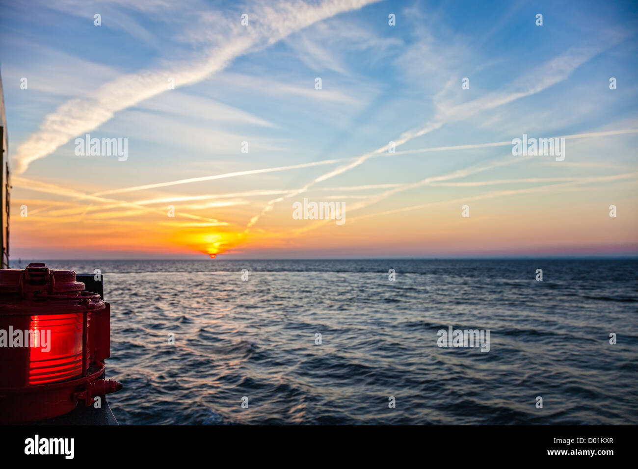 Navigation lamp on a ship with a view of the sunrise Stock Photo - Alamy
