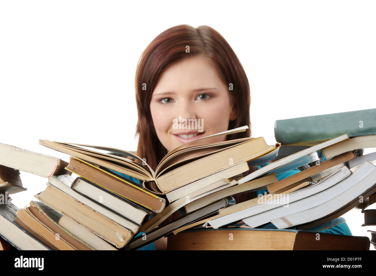 Young woman behind books Stock Photo - Alamy