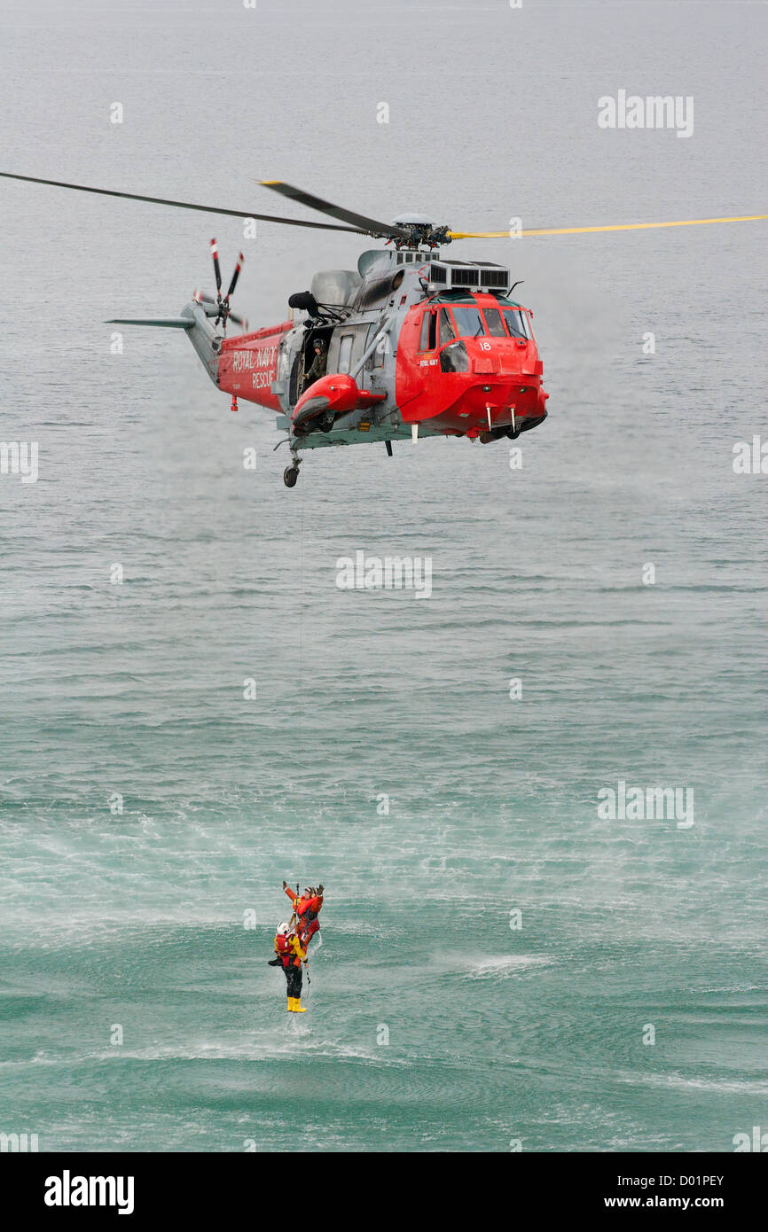 A winchman being lowered from a Search and Rescue helicopter off ...