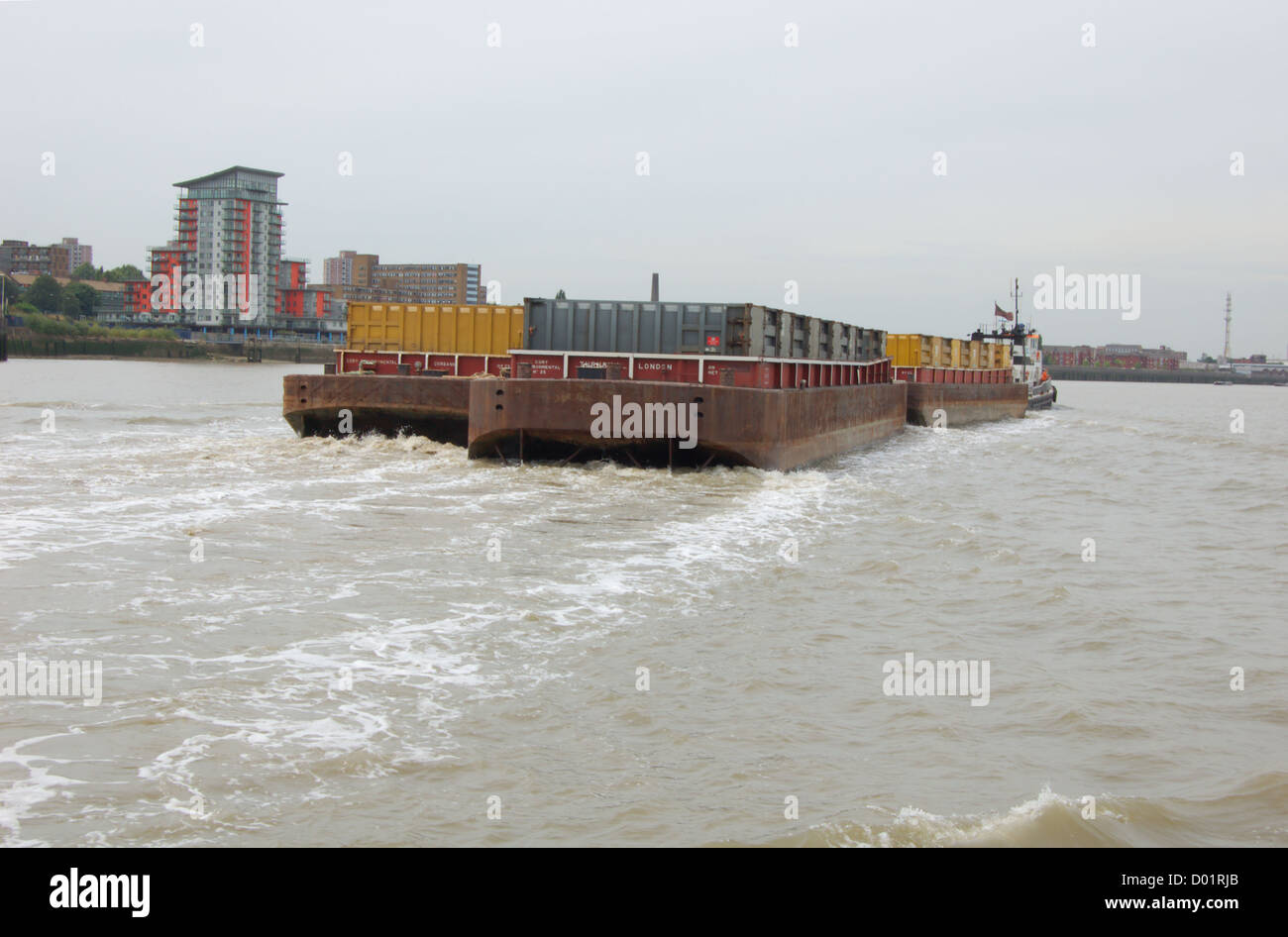 Container barges on the Thames at Woolwich in London, England Stock ...