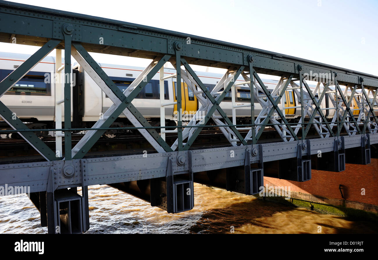 View from Hungerford footbridge of Hungerford railway bridge and train ...