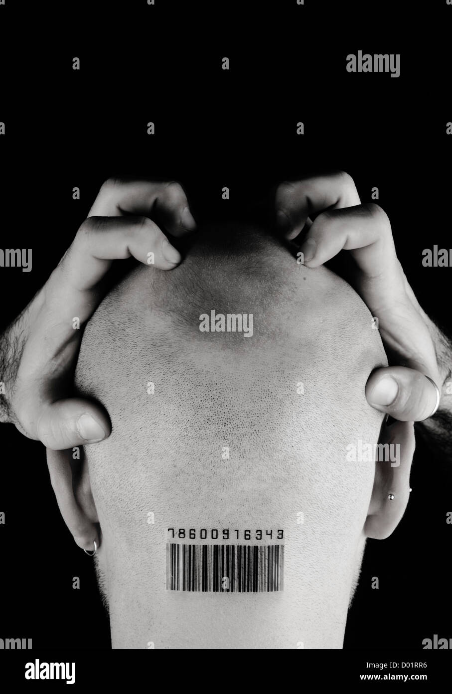 Man with bar code on head against black background Stock Photo - Alamy
