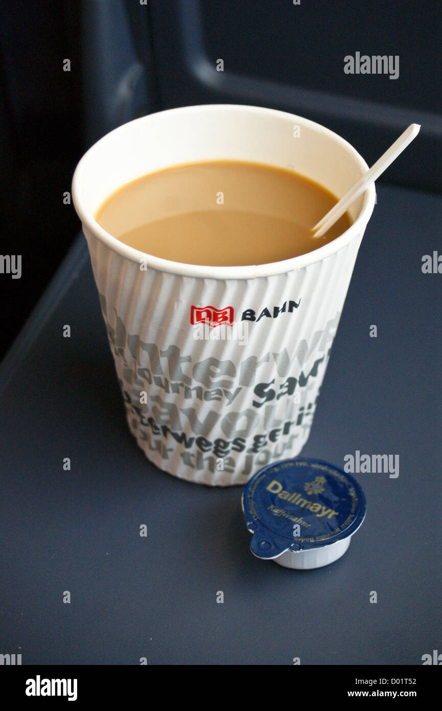 A cup of takeaway coffee in a Deutsche Bahn branded cup on a German ...