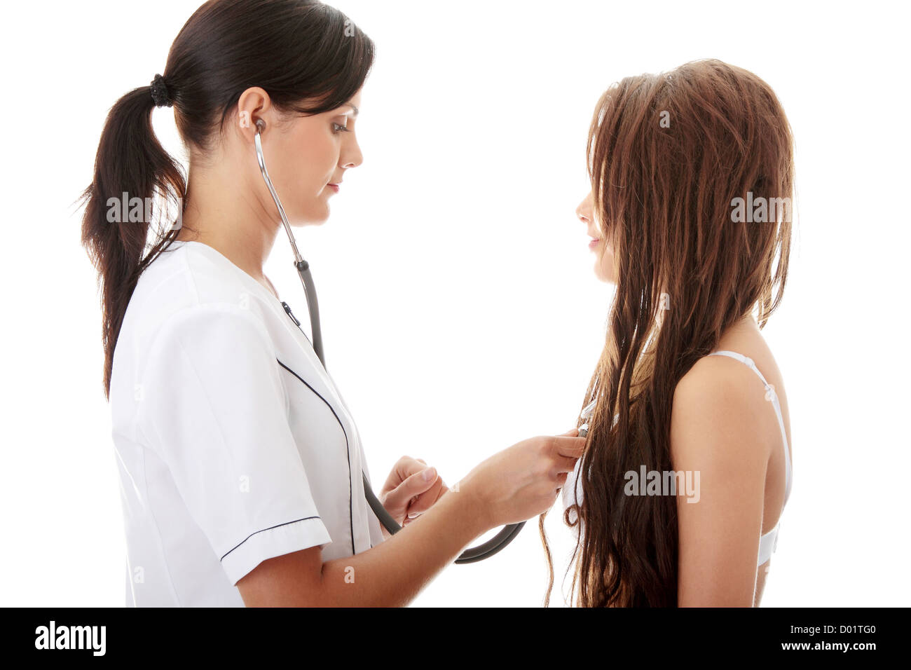 Young female doctor with female patient Stock Photo - Alamy