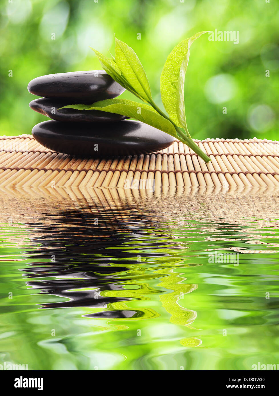 zen stones and water reflection showing spa concept Stock Photo - Alamy