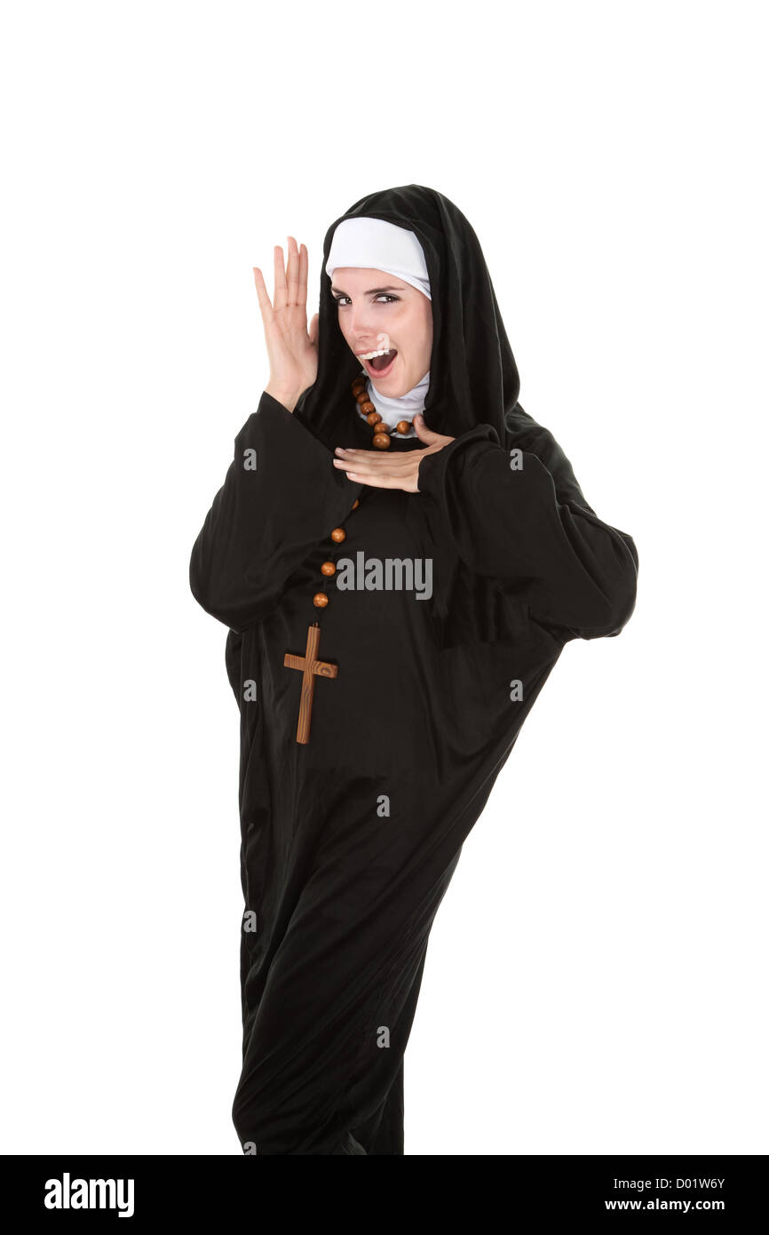 Young, attractive Catholic nun dancing on a white background Stock ...