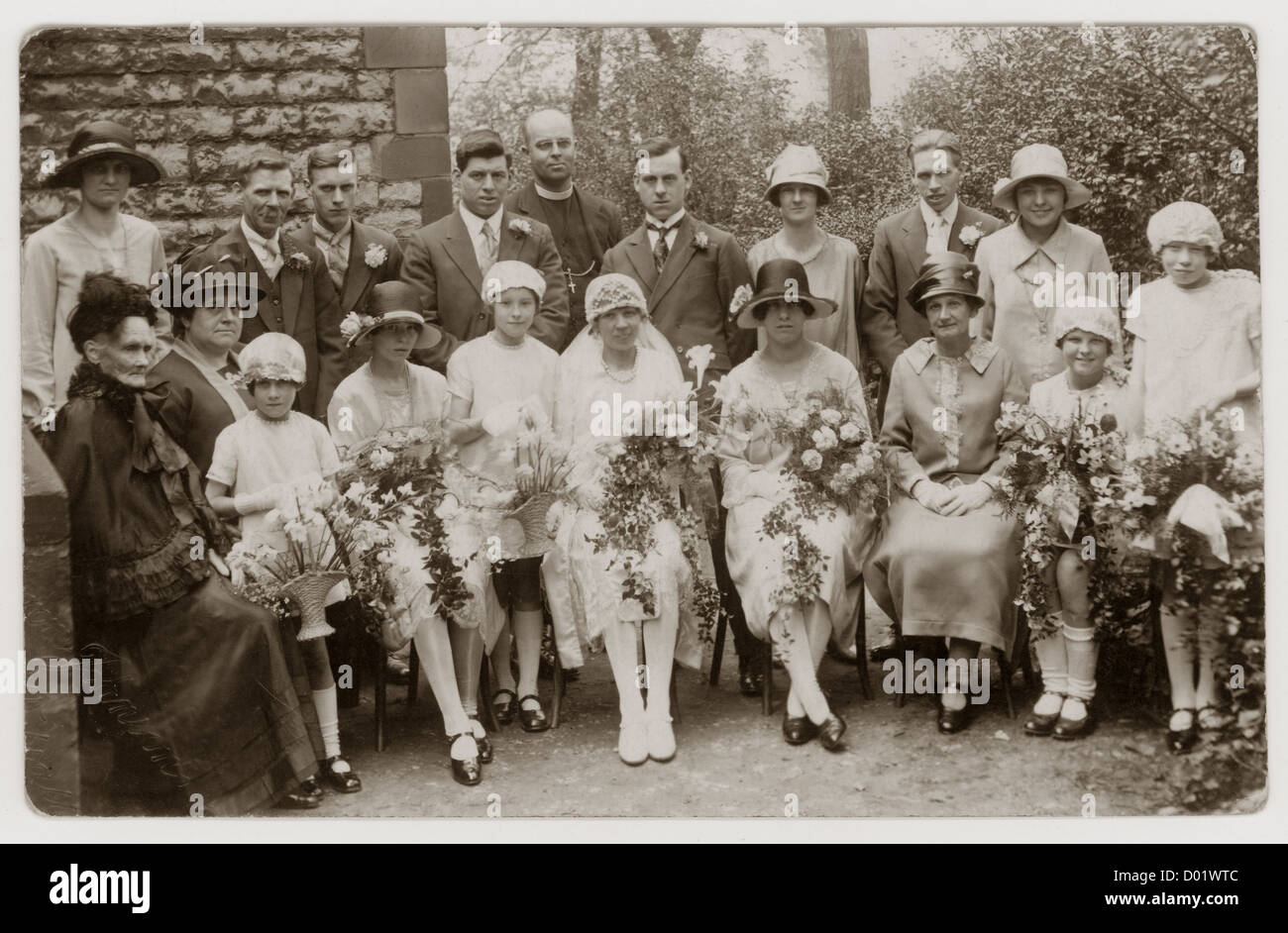 1920's postcard photo of wedding group,bride, bridegroom with the vicar ...