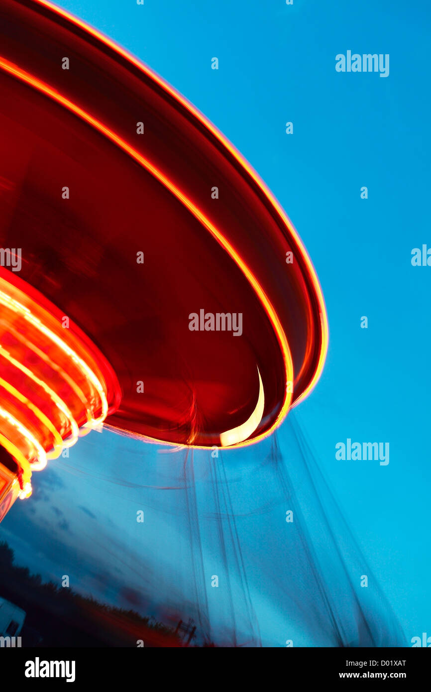 Swing seat Carousel ride at night Stock Photo - Alamy