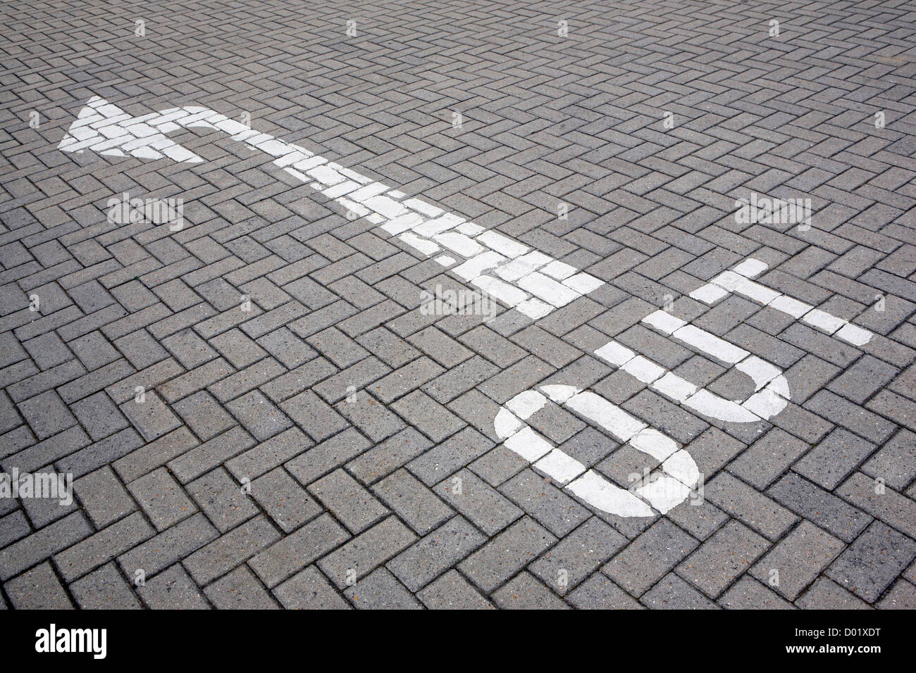 Road directions painted on the ground directing motorists out of car ...