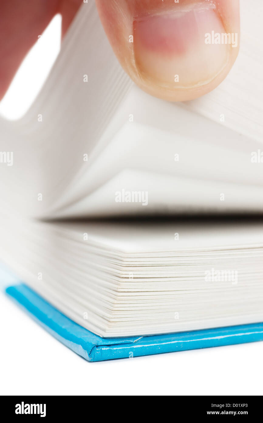 Male finger turning over the pages of thick book Stock Photo - Alamy