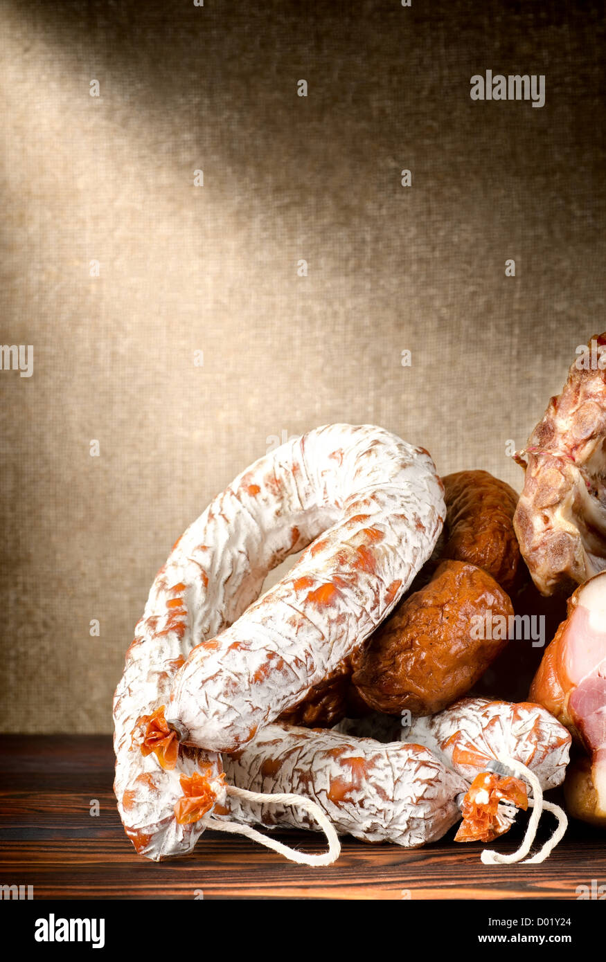 Cooked meat and sausages on the old background Stock Photo - Alamy