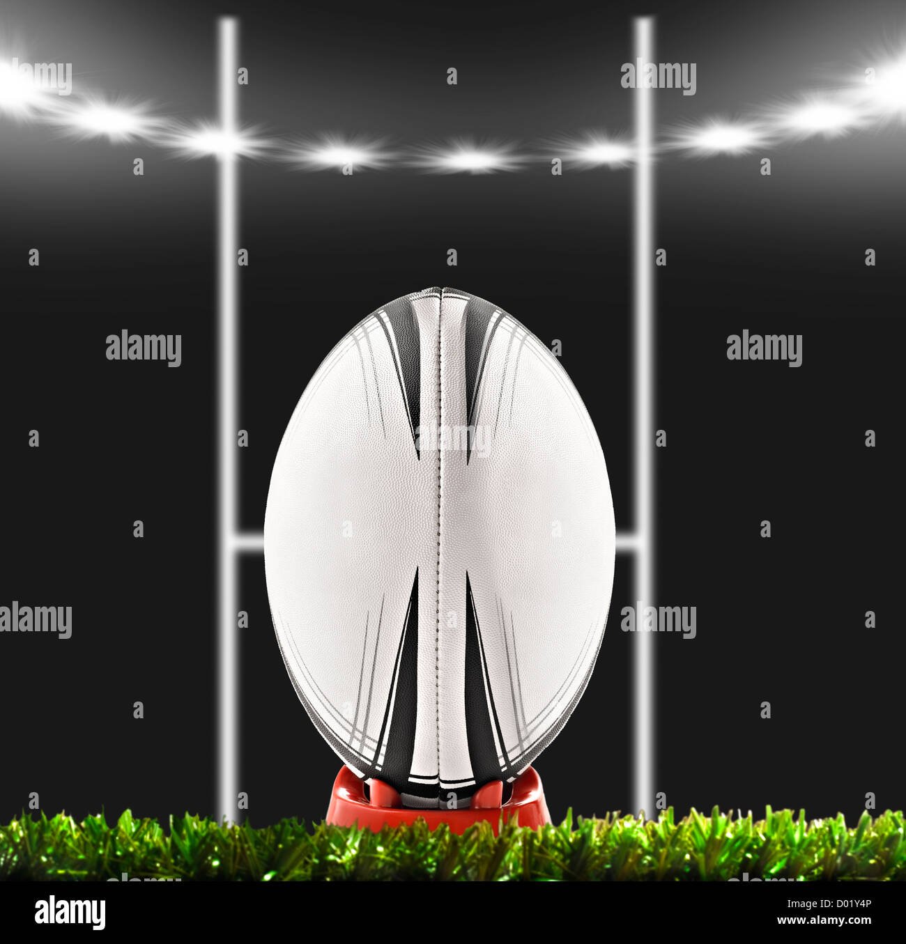 Rugby ball with goal posts under lights on the field at night Stock ...