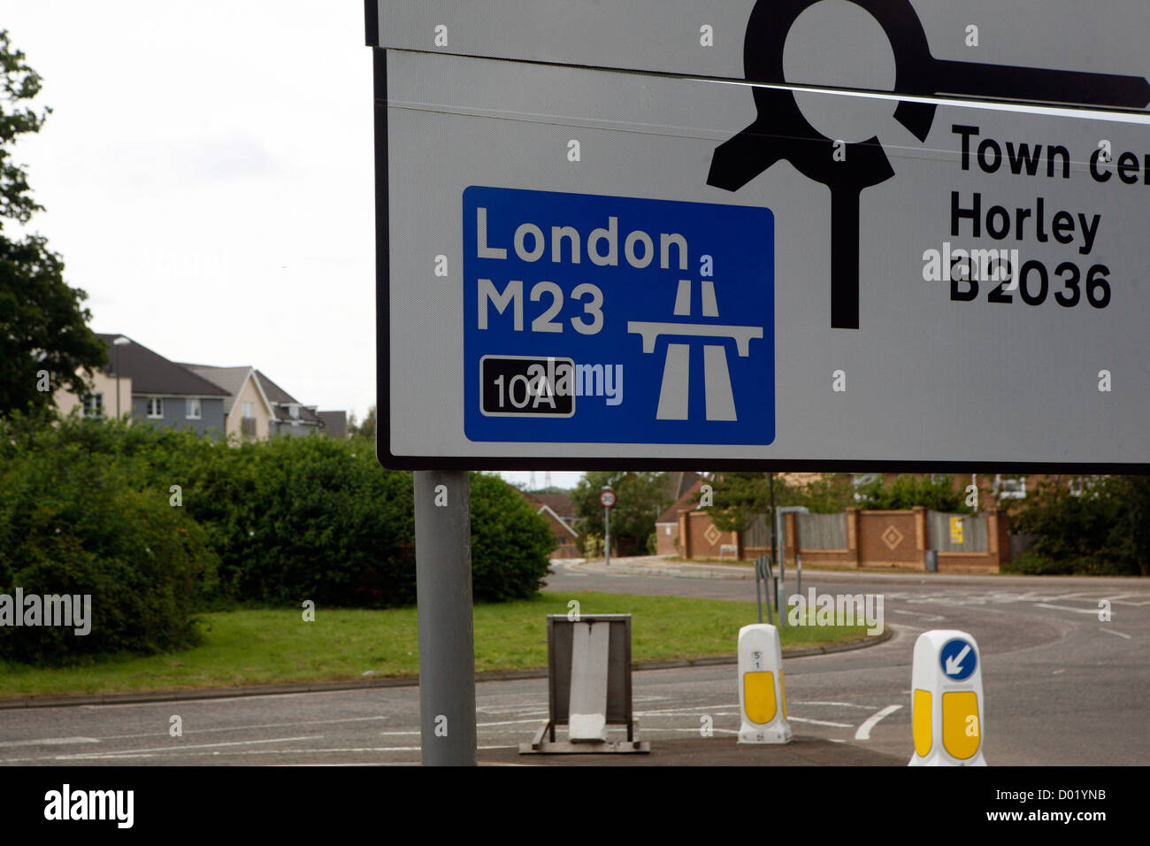 A motorway sign on a roundabout directing motorists to London M23 in ...
