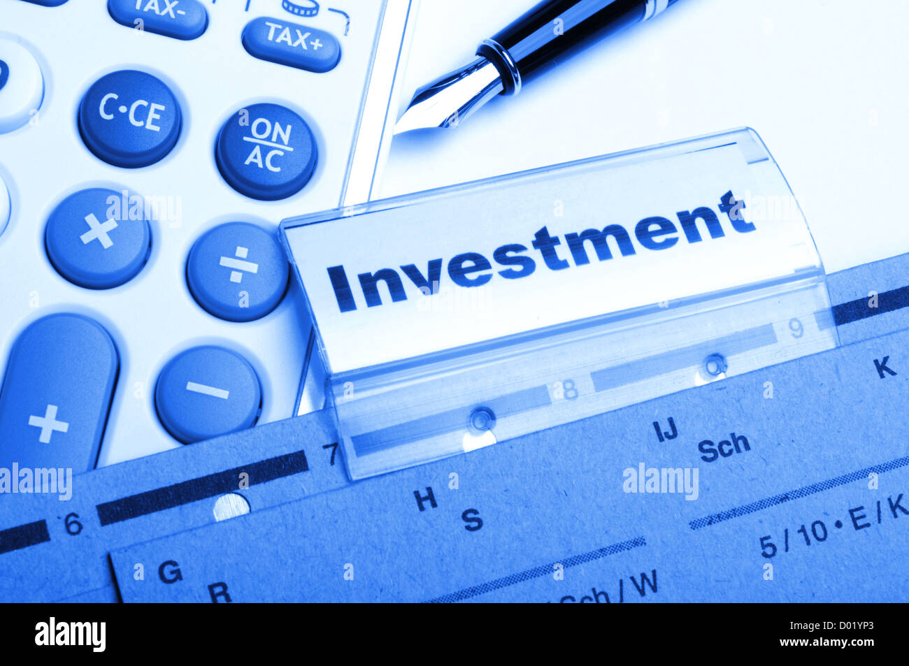 investment word on business folder showing financial success concept ...