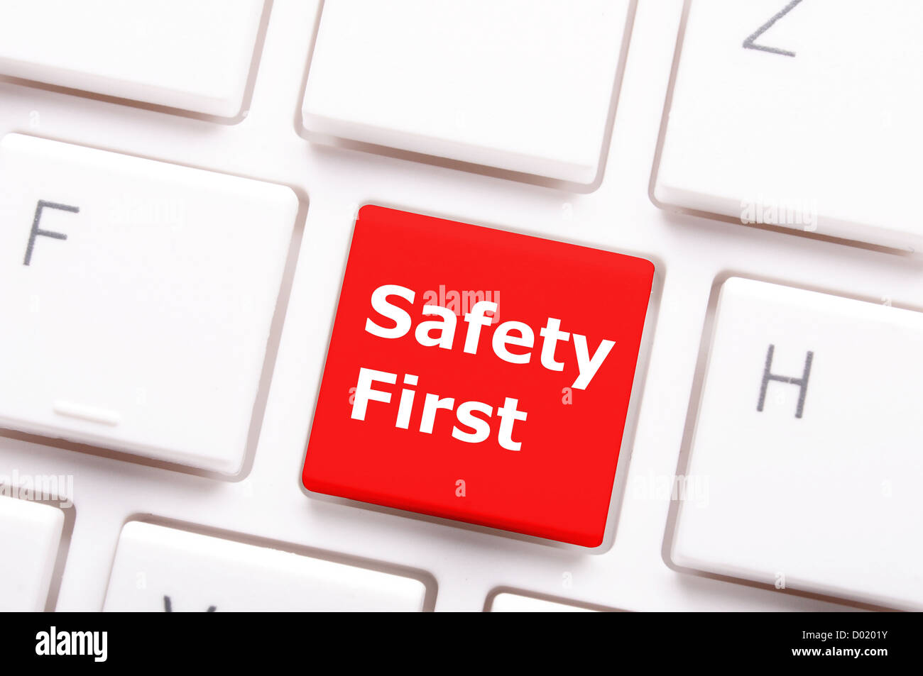 safety first on computer key showing security concept Stock Photo - Alamy
