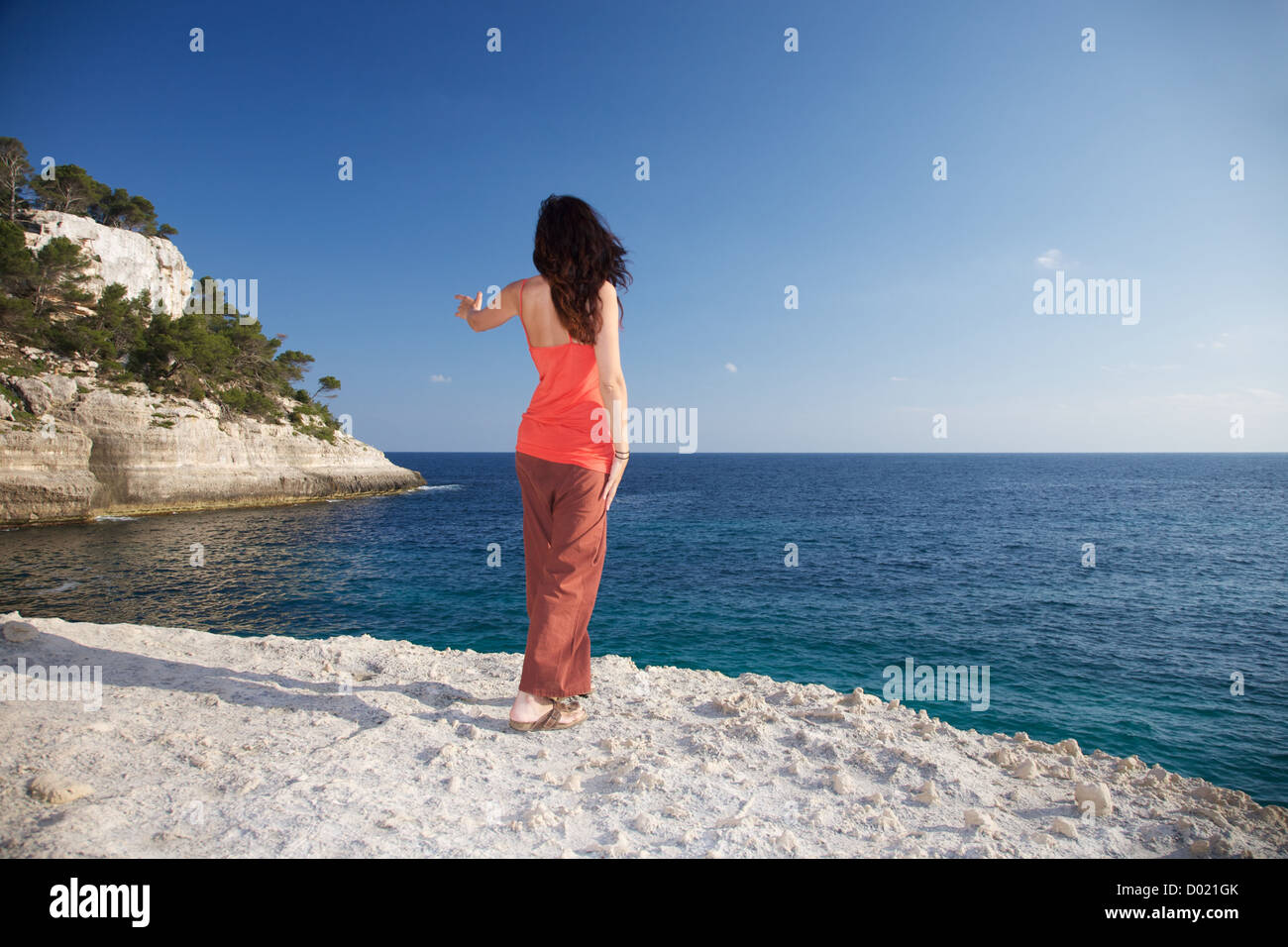 woman on red at Menorca island in Spain Stock Photo - Alamy