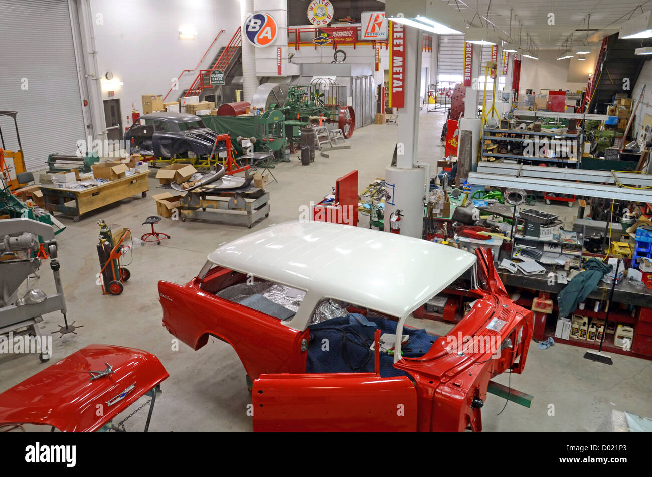 A commercial workshop with a car in the foreground Stock Photo - Alamy