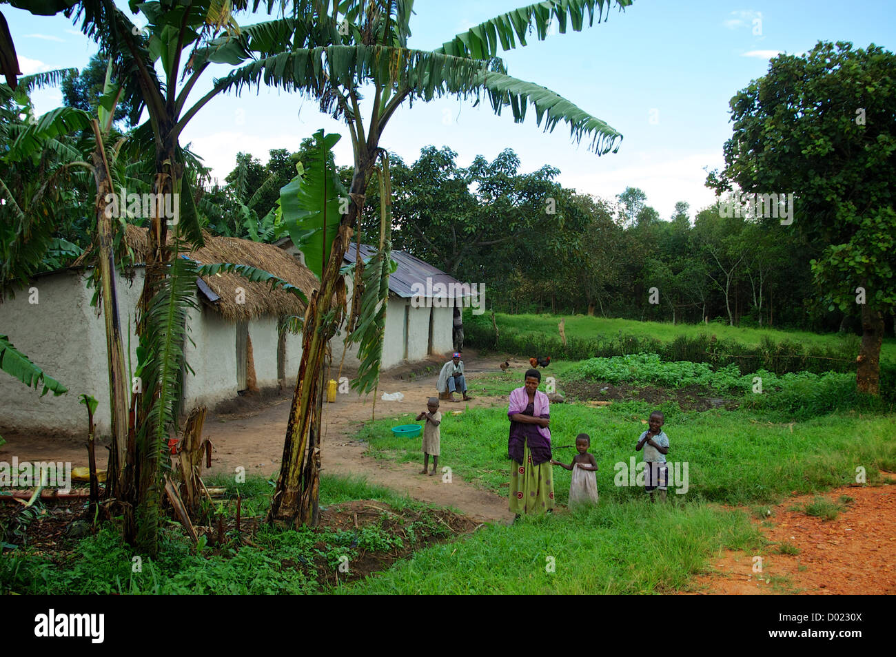 African family in rural village setting Stock Photo - Alamy