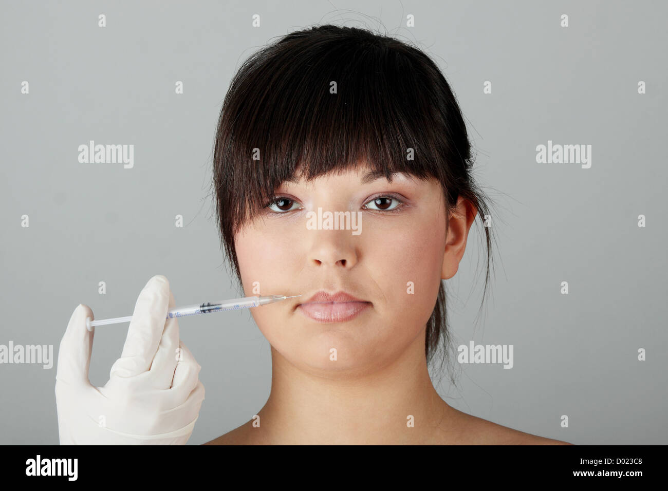 Pretty woman getting botox injection hi-res stock photography and ...