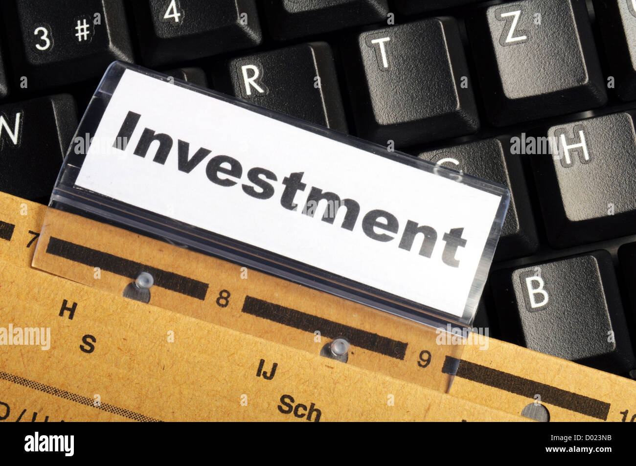 investment word on business folder showing financial success concept ...