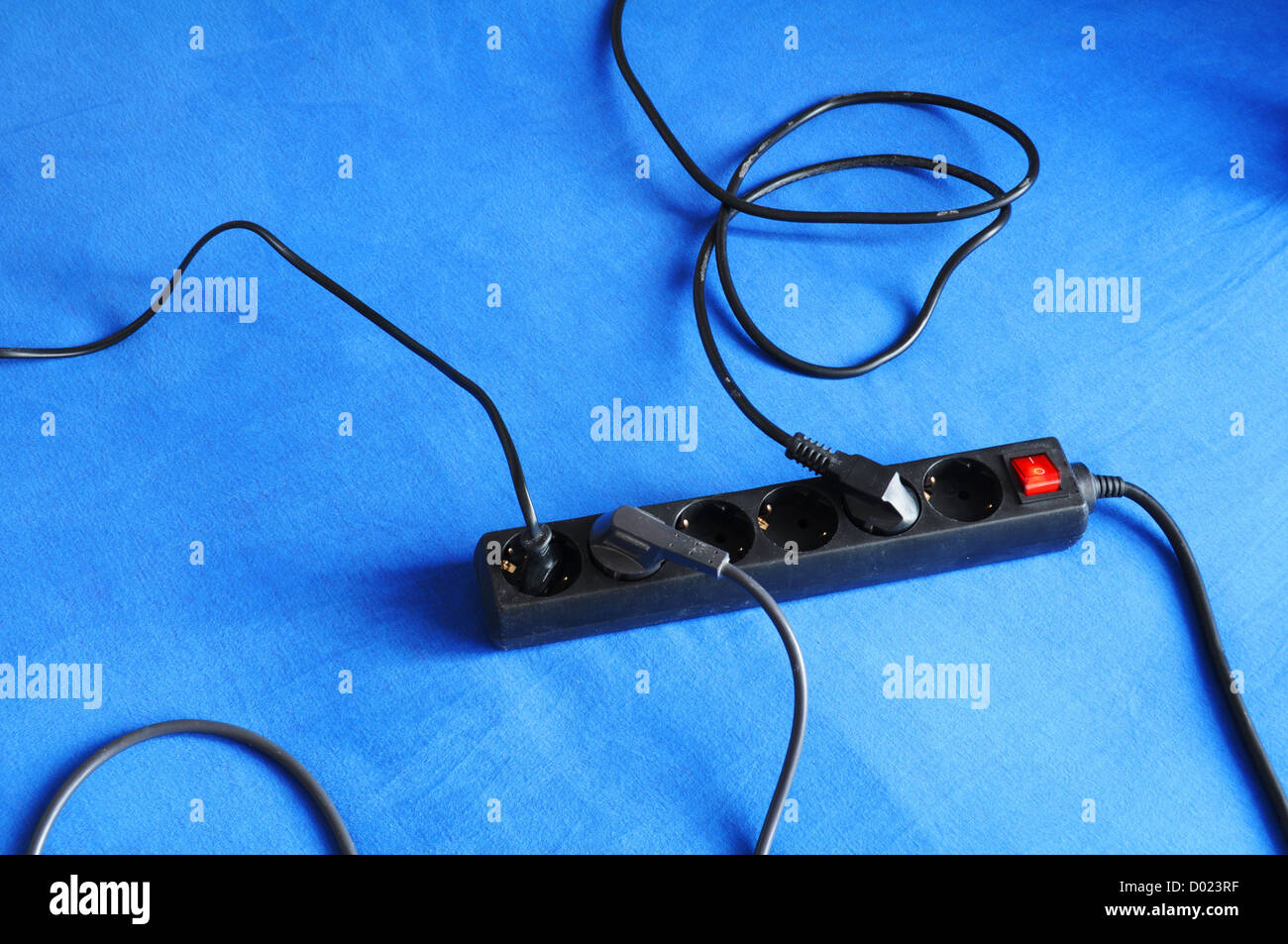 save power concept with plug wire and blue copyspace Stock Photo - Alamy