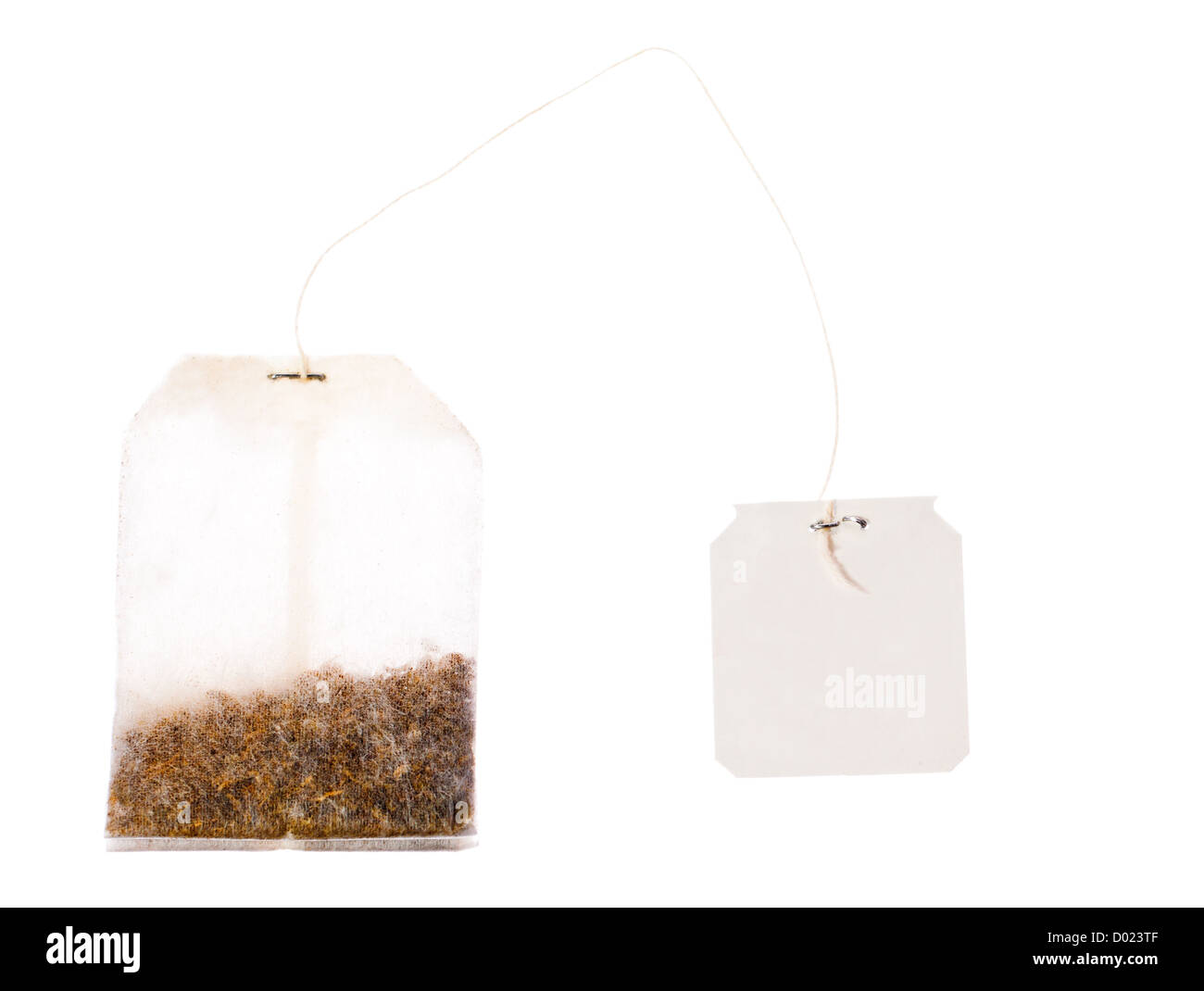 A tea bag with a blank labek on a string. Isolated over white with ...