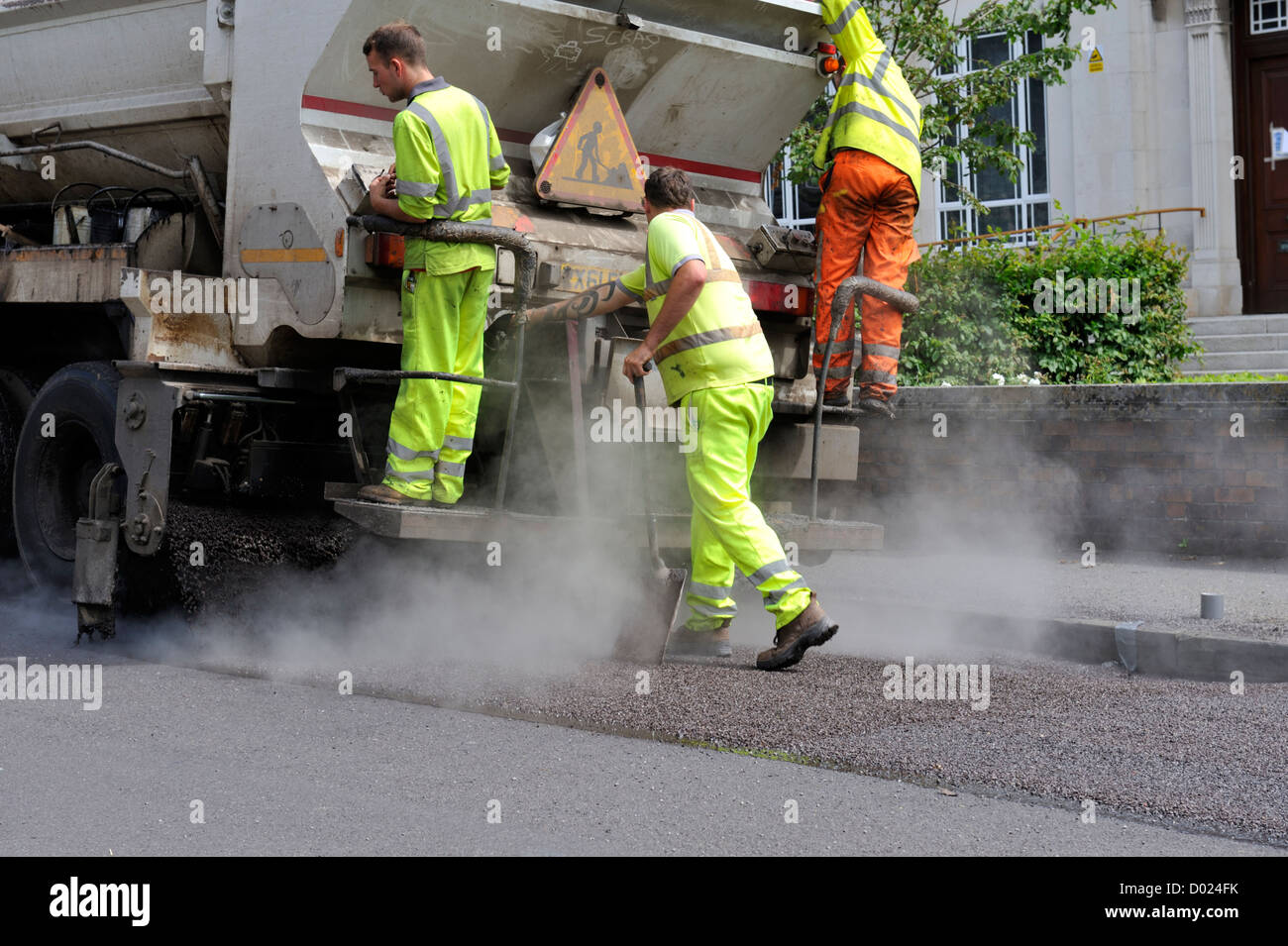 Road resurfacing in residential street UK Stock Photo - Alamy