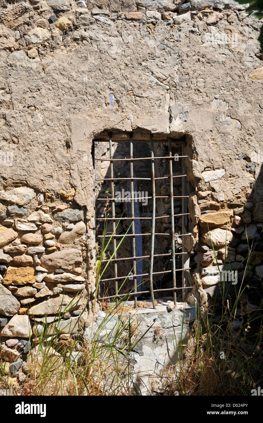 Window with bars in derelict stone building Stock Photo - Alamy