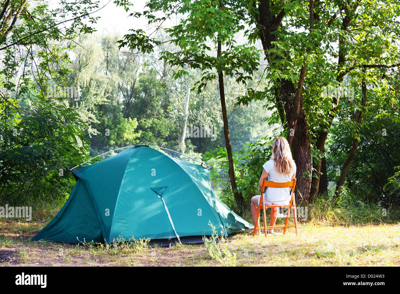 Girl resting in camping Stock Photo - Alamy