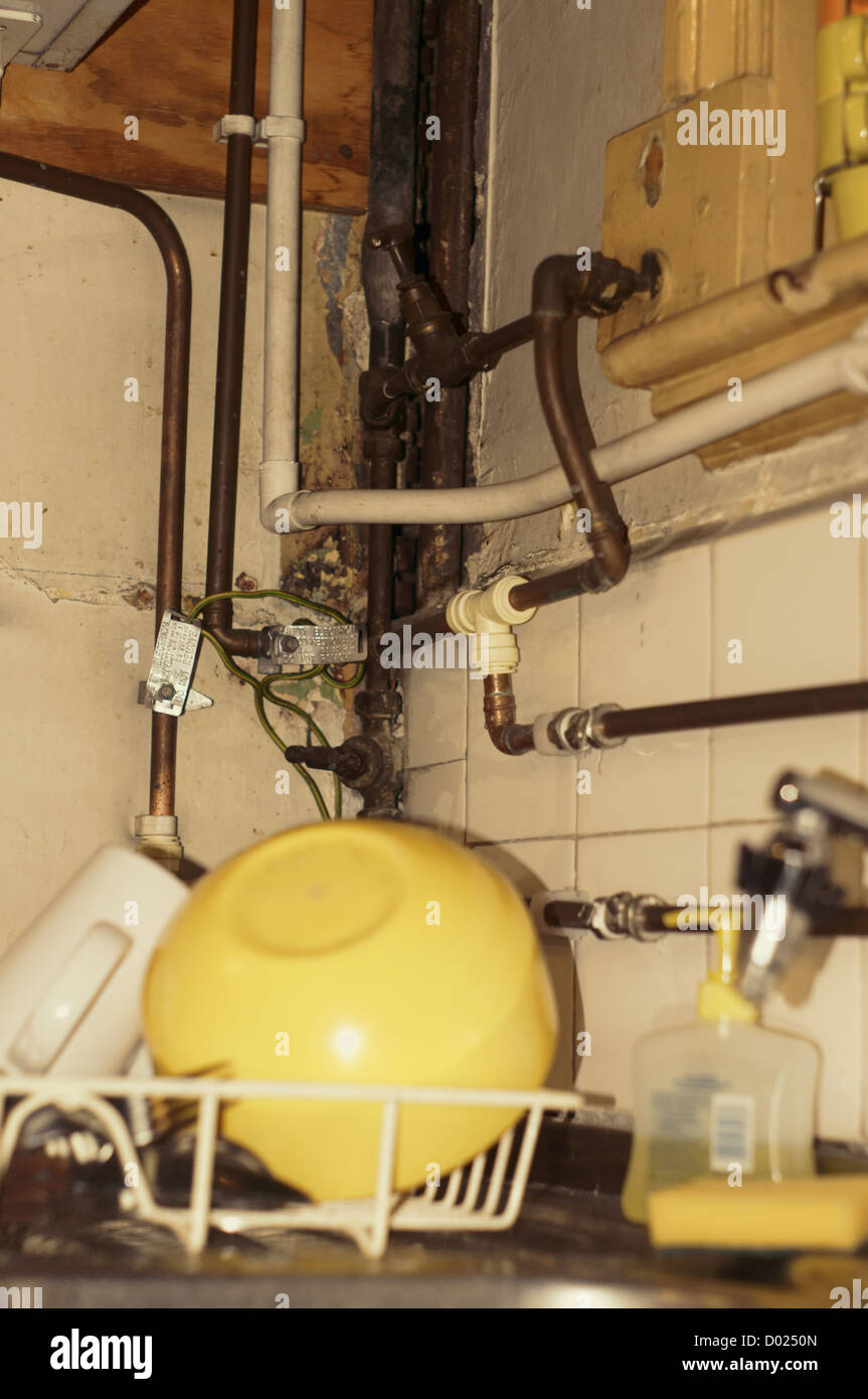 Old Kitchen Pipes near a sink Stock Photo - Alamy