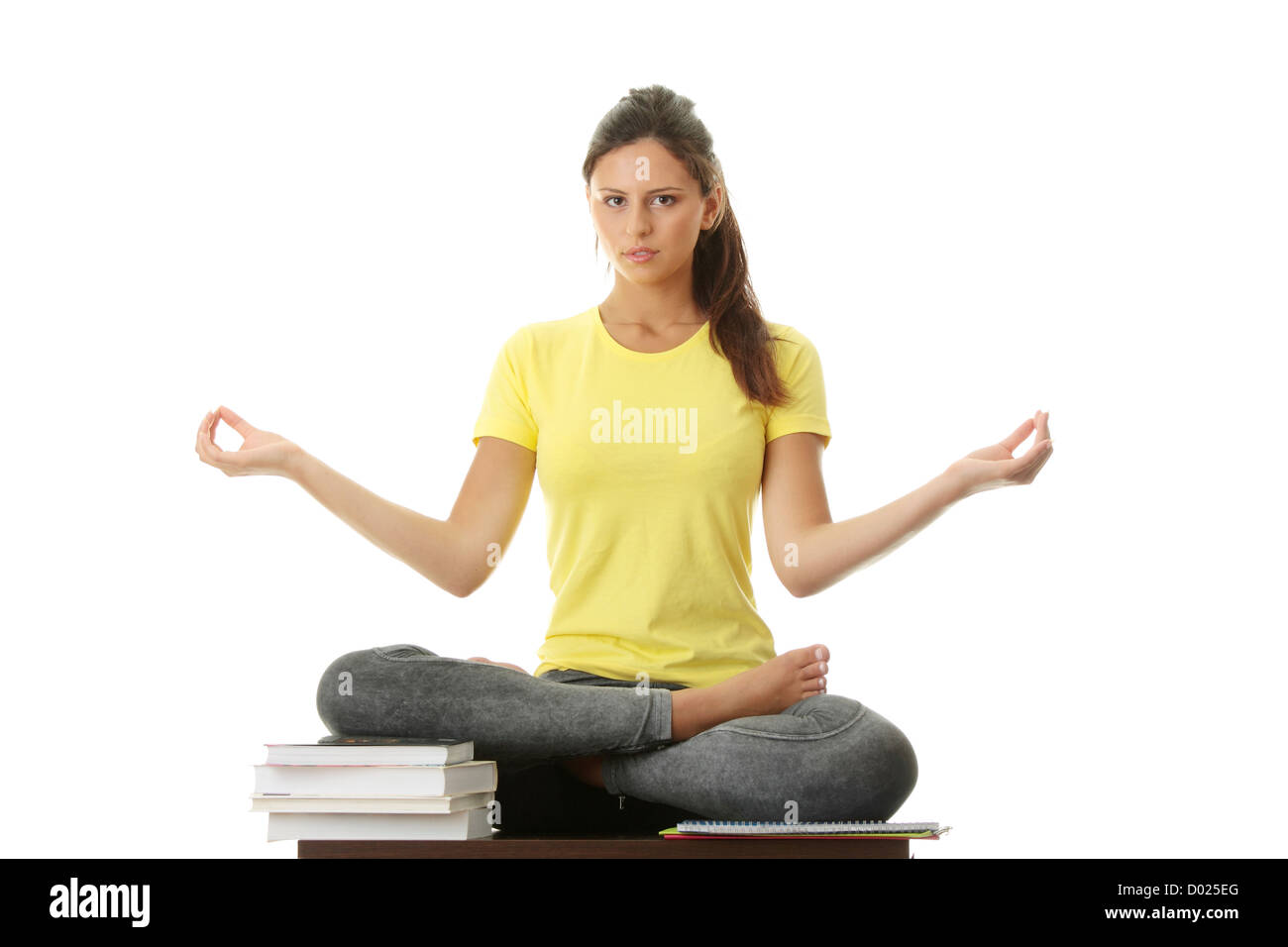 Student gir meditating Stock Photo - Alamy
