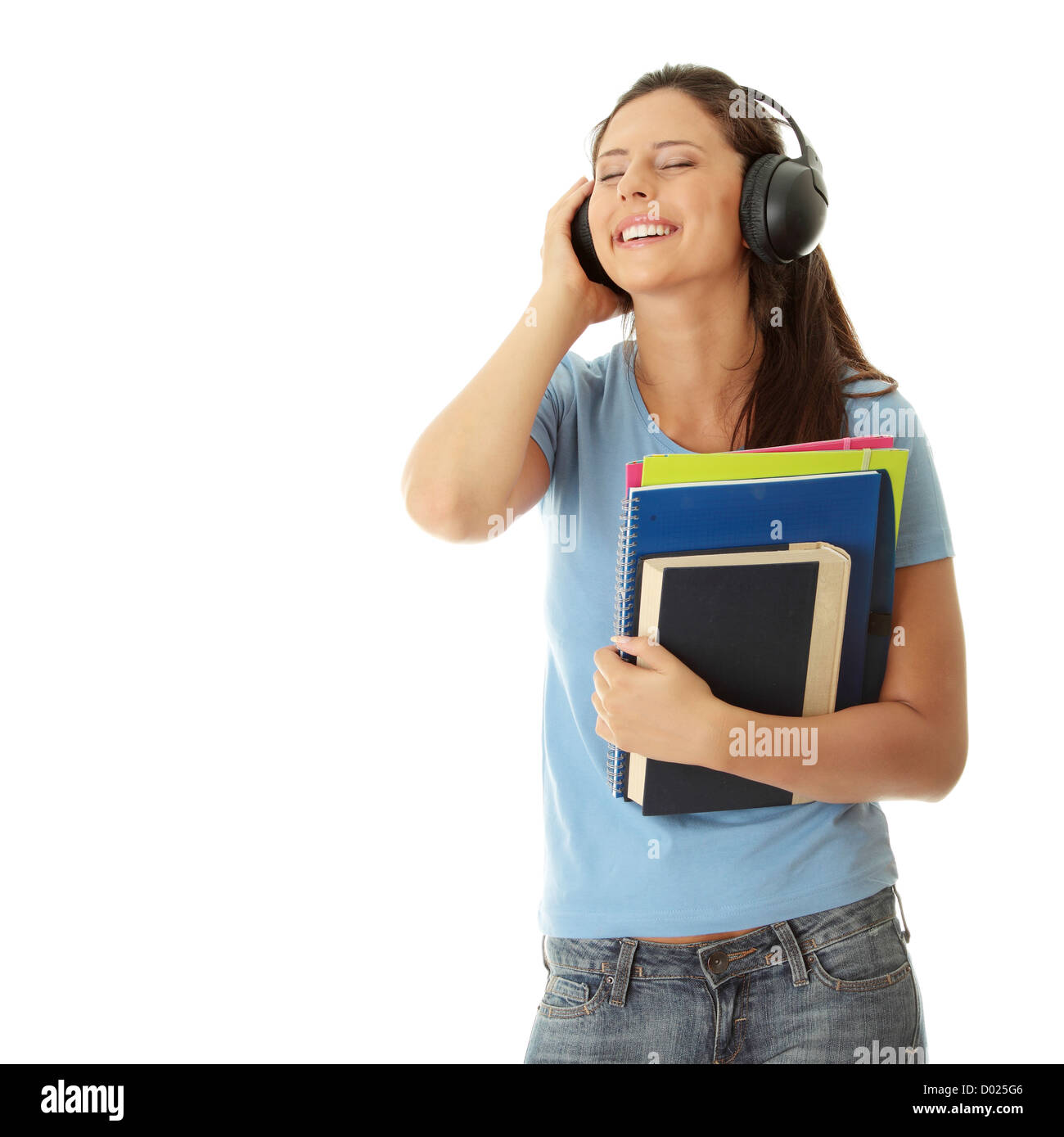 Happy student girl listening to the music, isolated on white Stock ...
