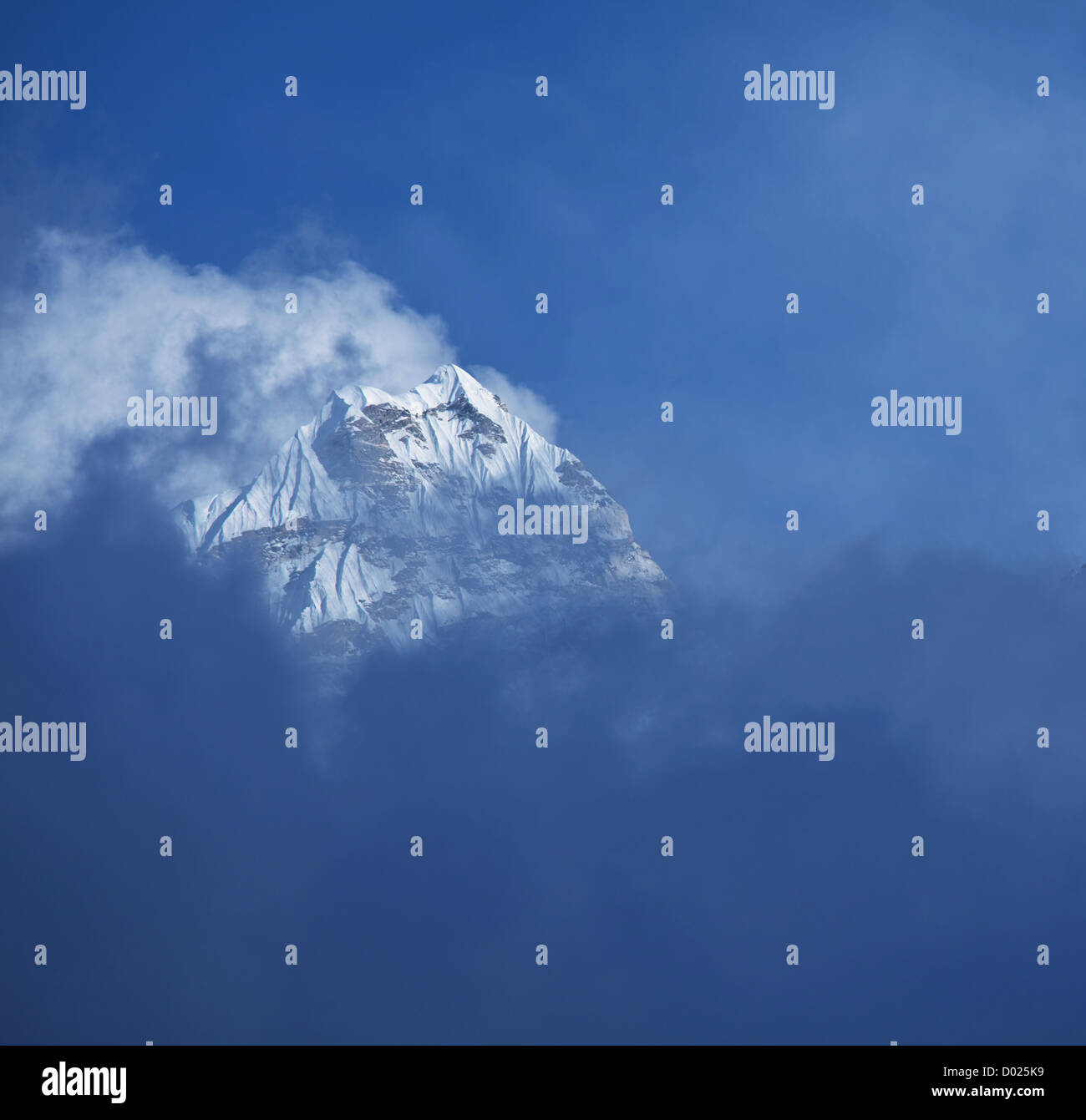 High peak in clouds Stock Photo - Alamy