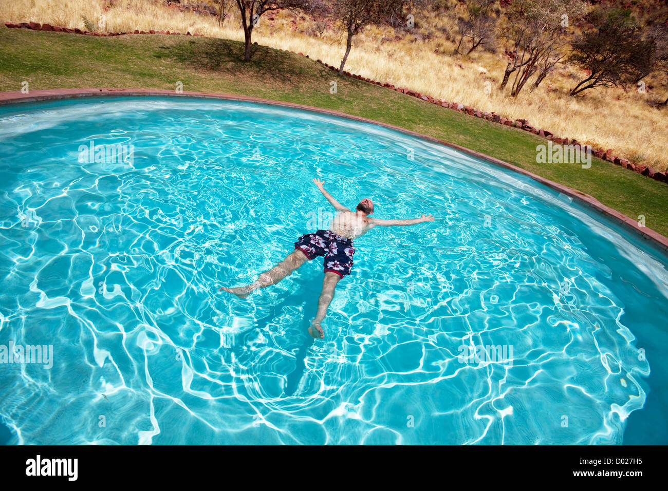 Men relaxing swimming water park hi-res stock photography and images ...