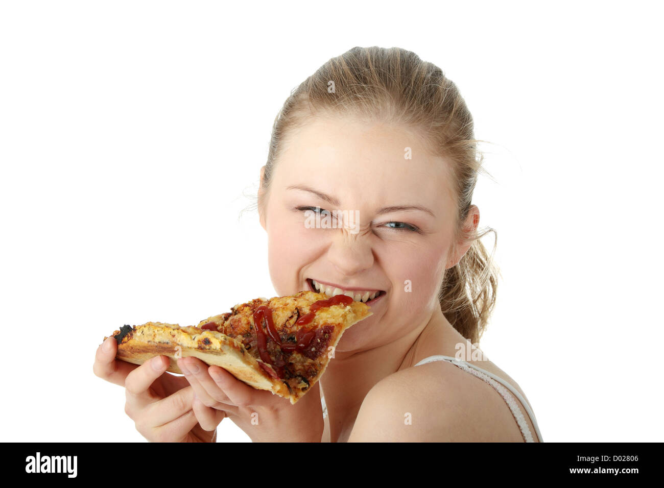 Young happy woman eating pizza Stock Photo - Alamy
