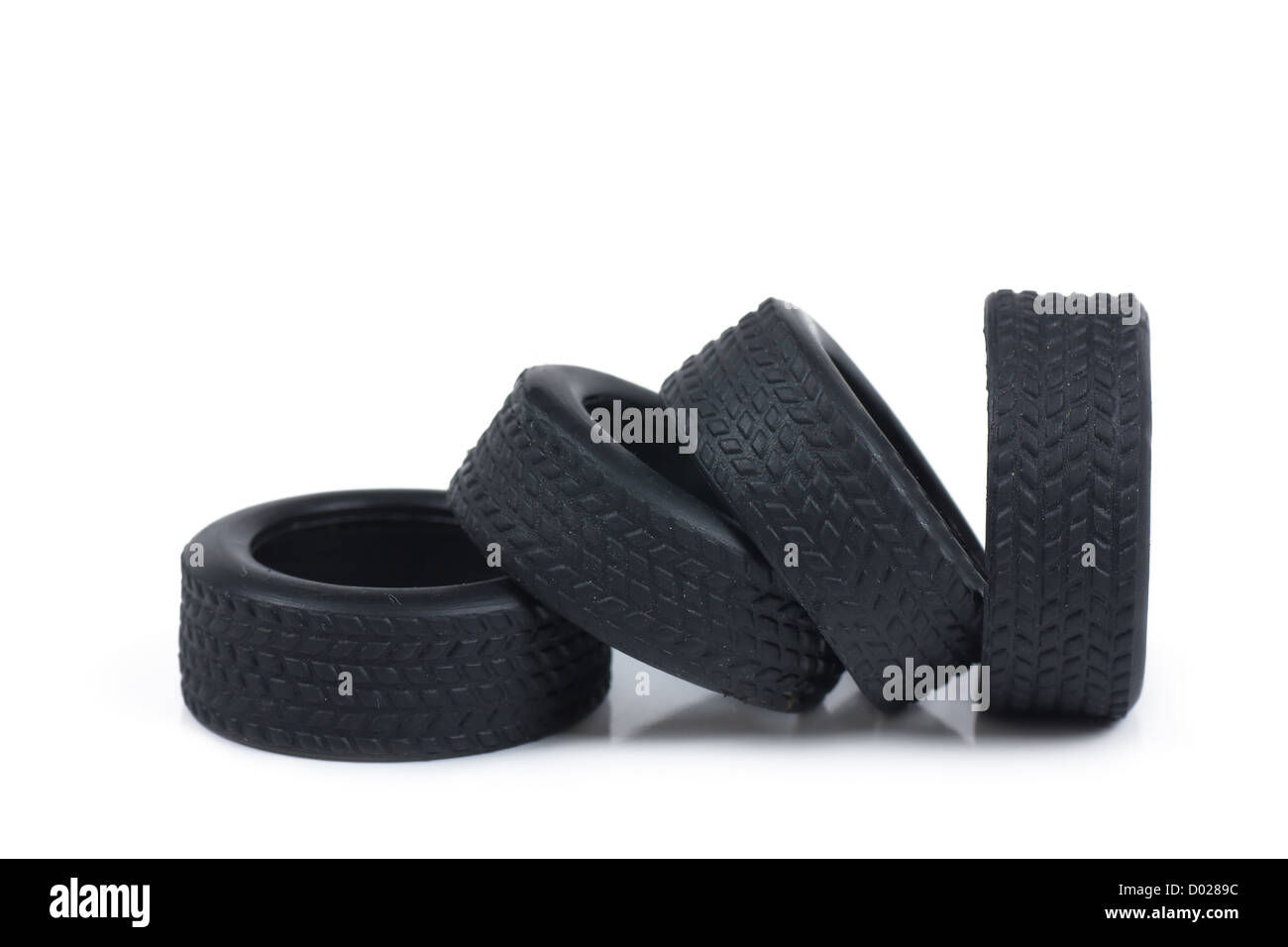 A stack of toy tires isolated on the white Stock Photo - Alamy