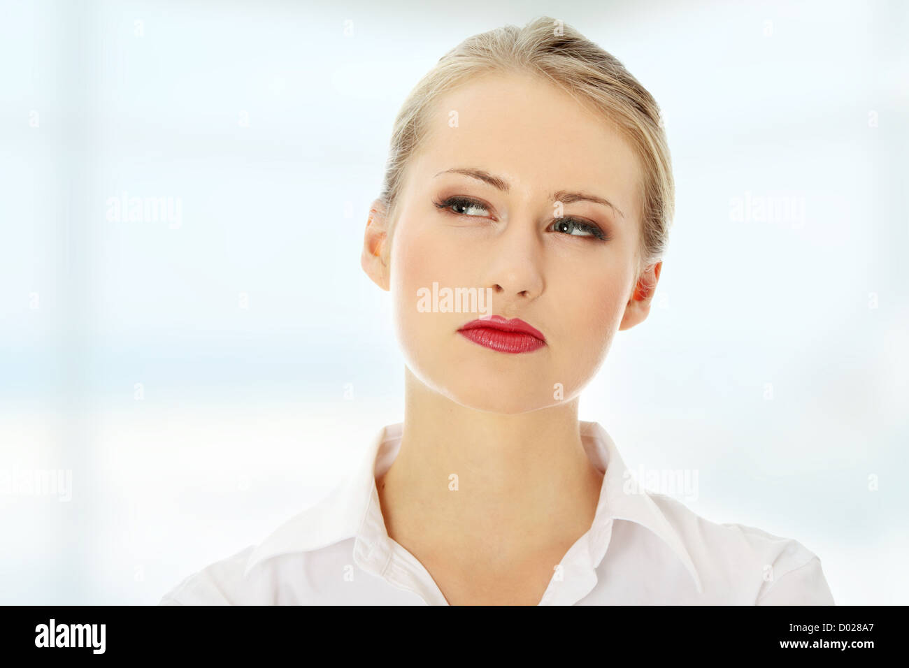 Thoughtful business woman looking left Stock Photo - Alamy