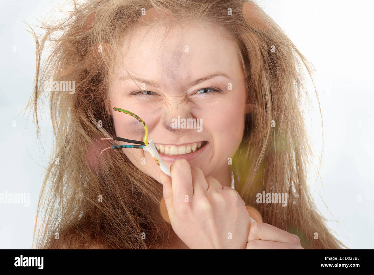 Young woman with wire - electric shock Stock Photo - Alamy