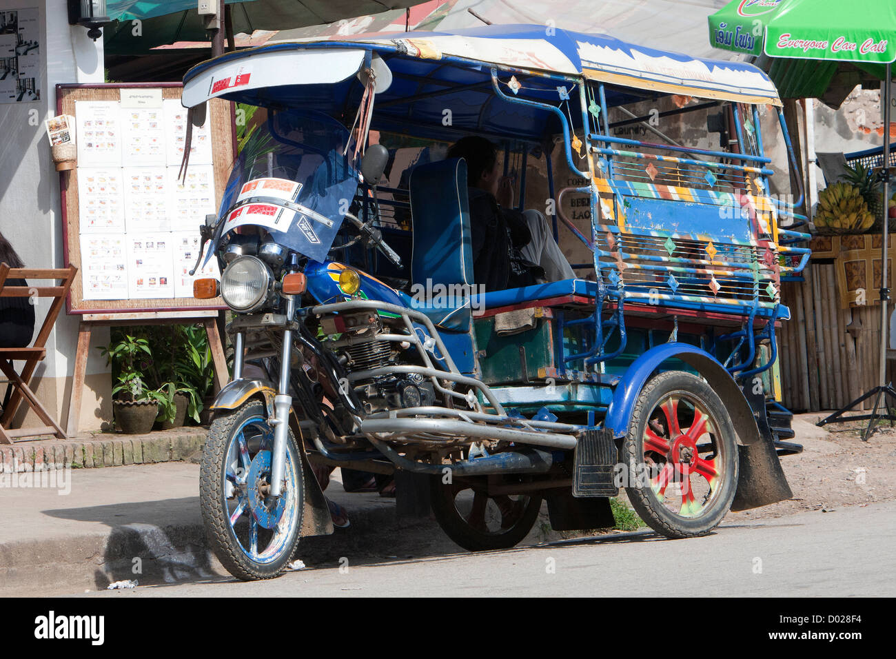 Tricycle rickshaw taxi old quarter Luang Prabang Laos PDR Stock Photo ...