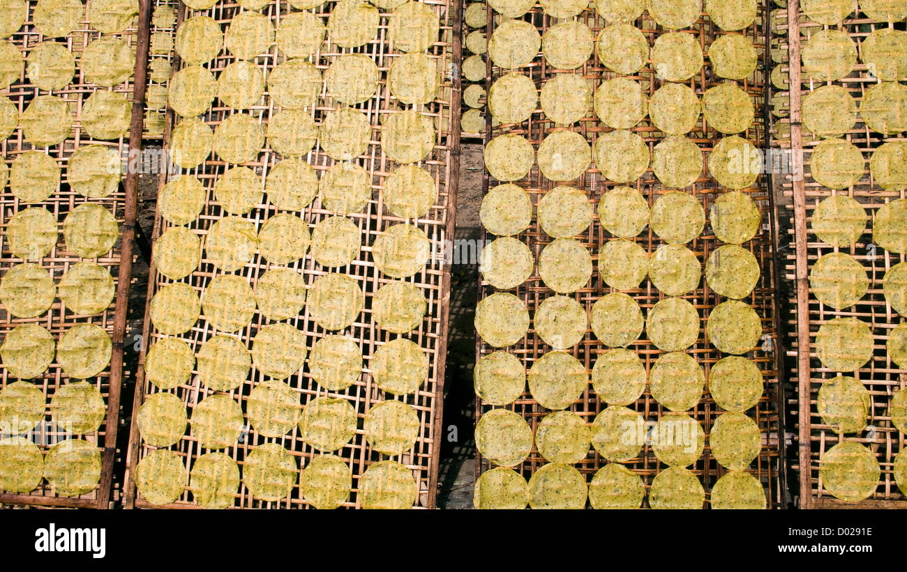 Rice cakes drying on rack in street Luang Prabang Laos PDR Stock Photo ...