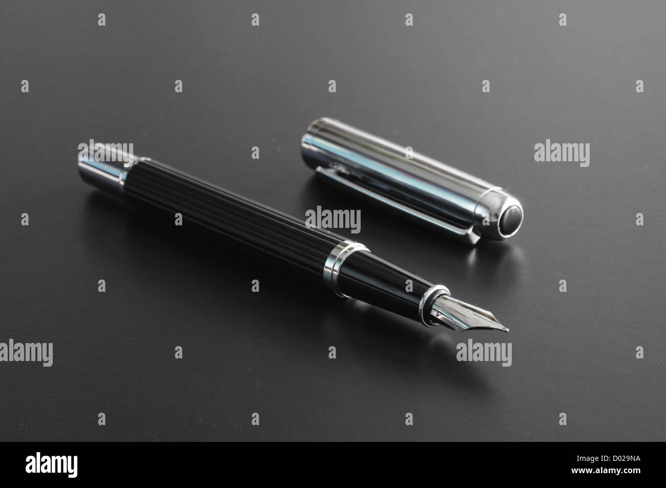 pen showing communication contact us or mail concept on black ...