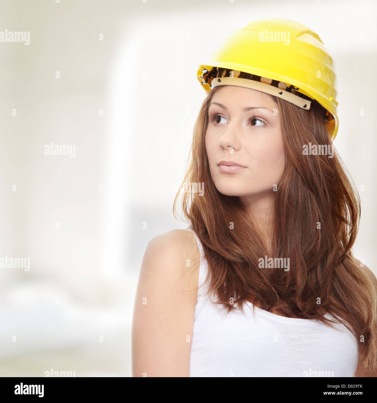 Engineer woman in yellow helmet Stock Photo - Alamy