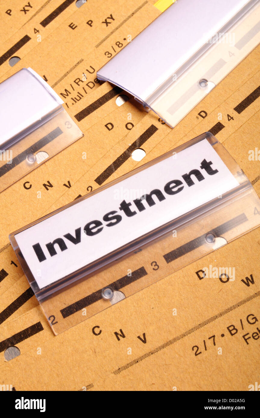 investment word on business folder showing financial success concept ...