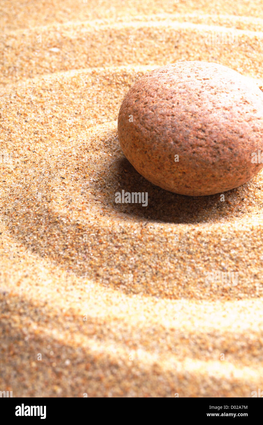 zen stone with leaf on sand showing spa concept Stock Photo - Alamy