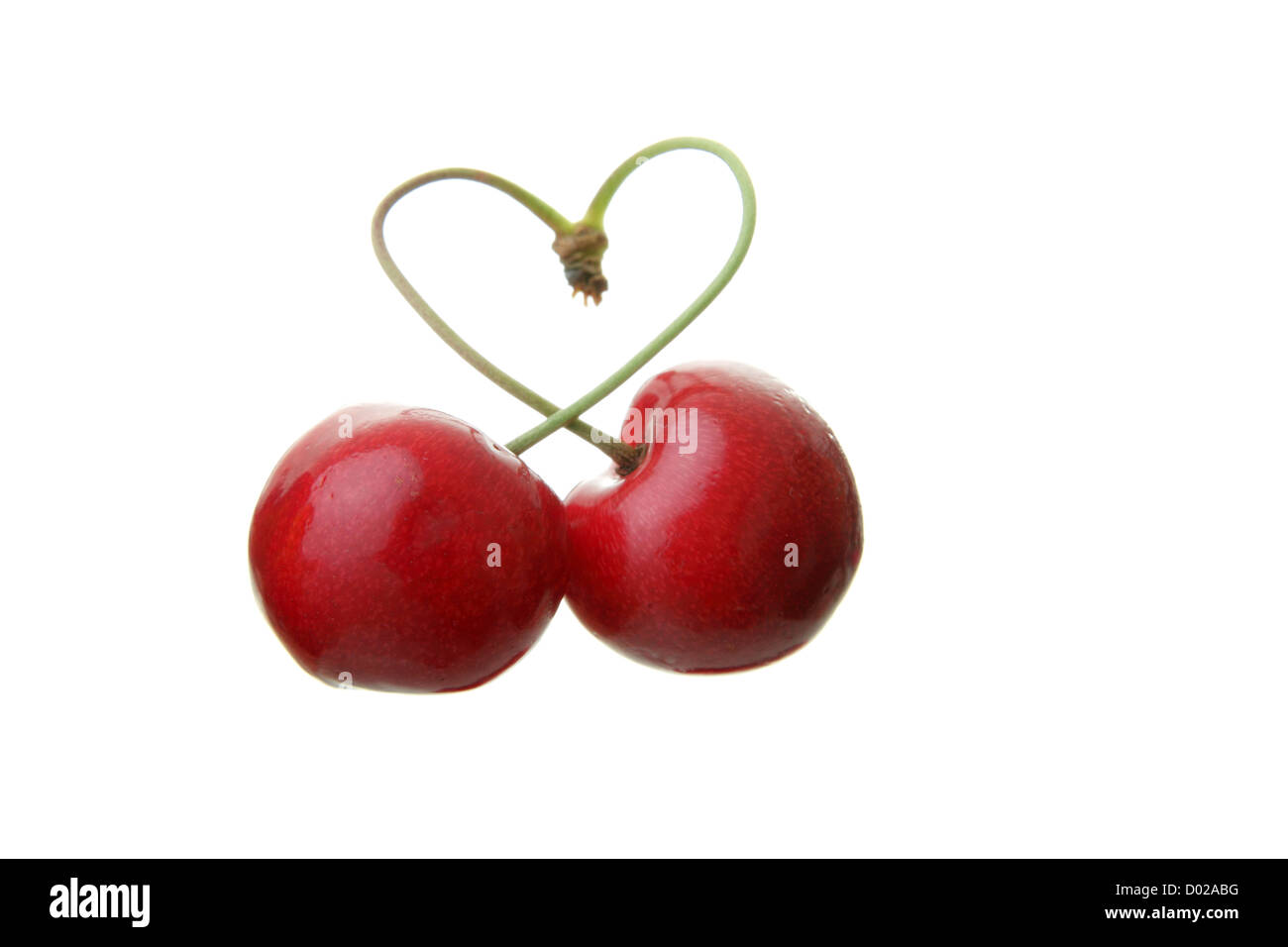 Two cherries isolated on white background Stock Photo - Alamy