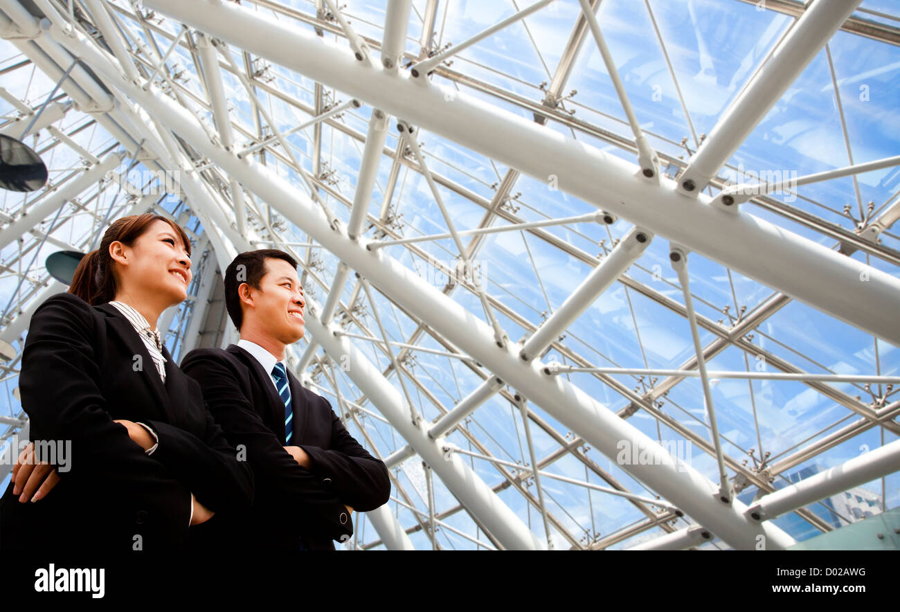 two business people stand in modern office Stock Photo - Alamy