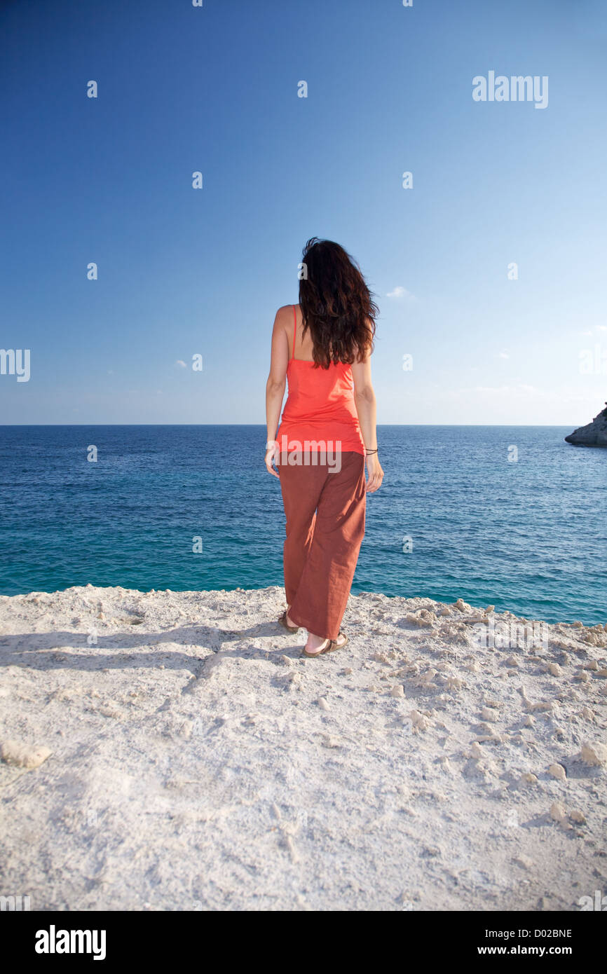 woman on red at Menorca island in Spain Stock Photo - Alamy